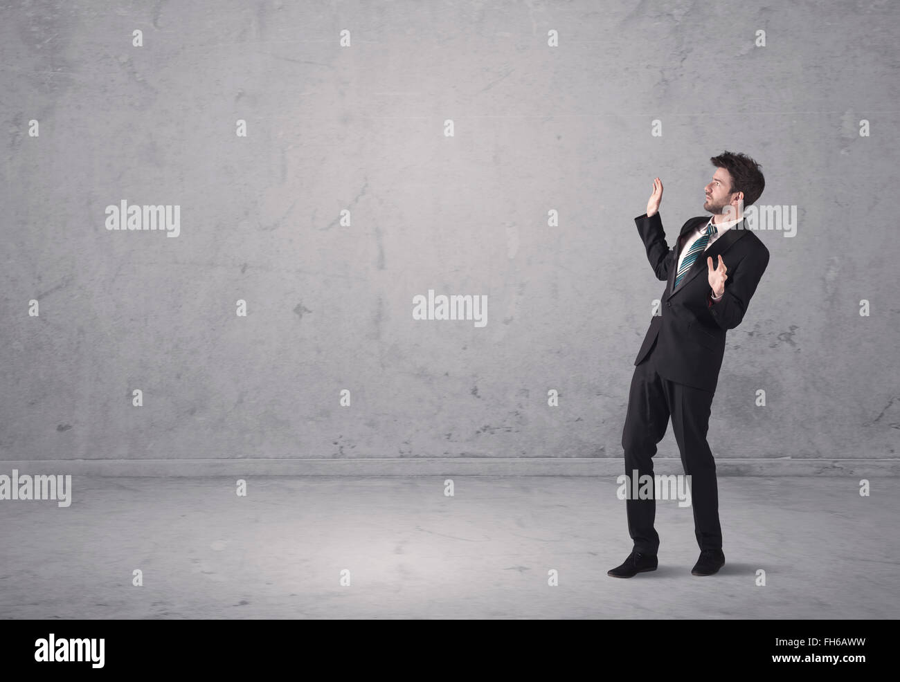 Young businessman standing confused Stock Photo - Alamy