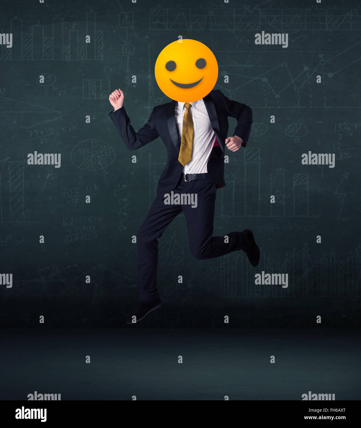 businessman wears yellow smiley face Stock Photo - Alamy