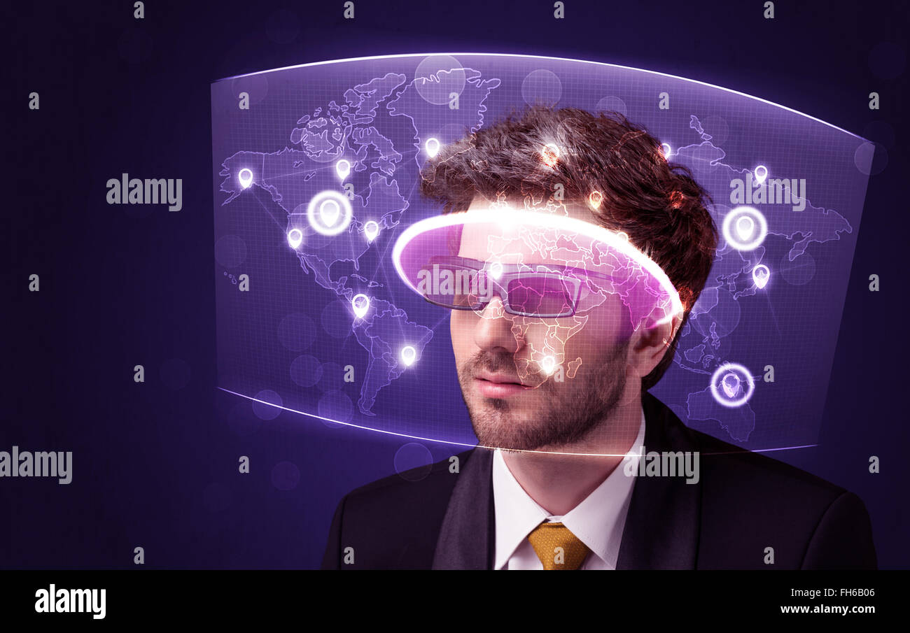 Young man looking at futuristic social network map Stock Photo - Alamy
