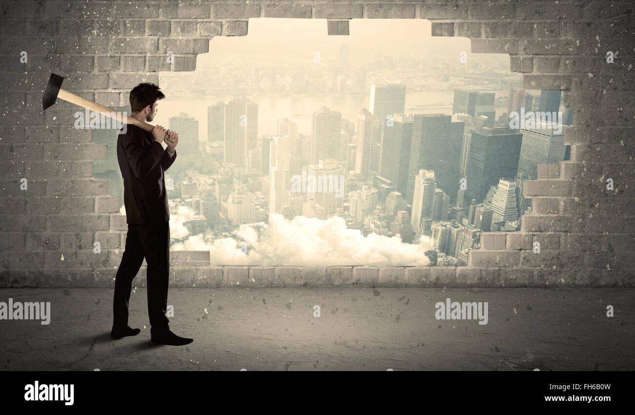 Business man hitting wall with hammer on city view Stock Photo - Alamy