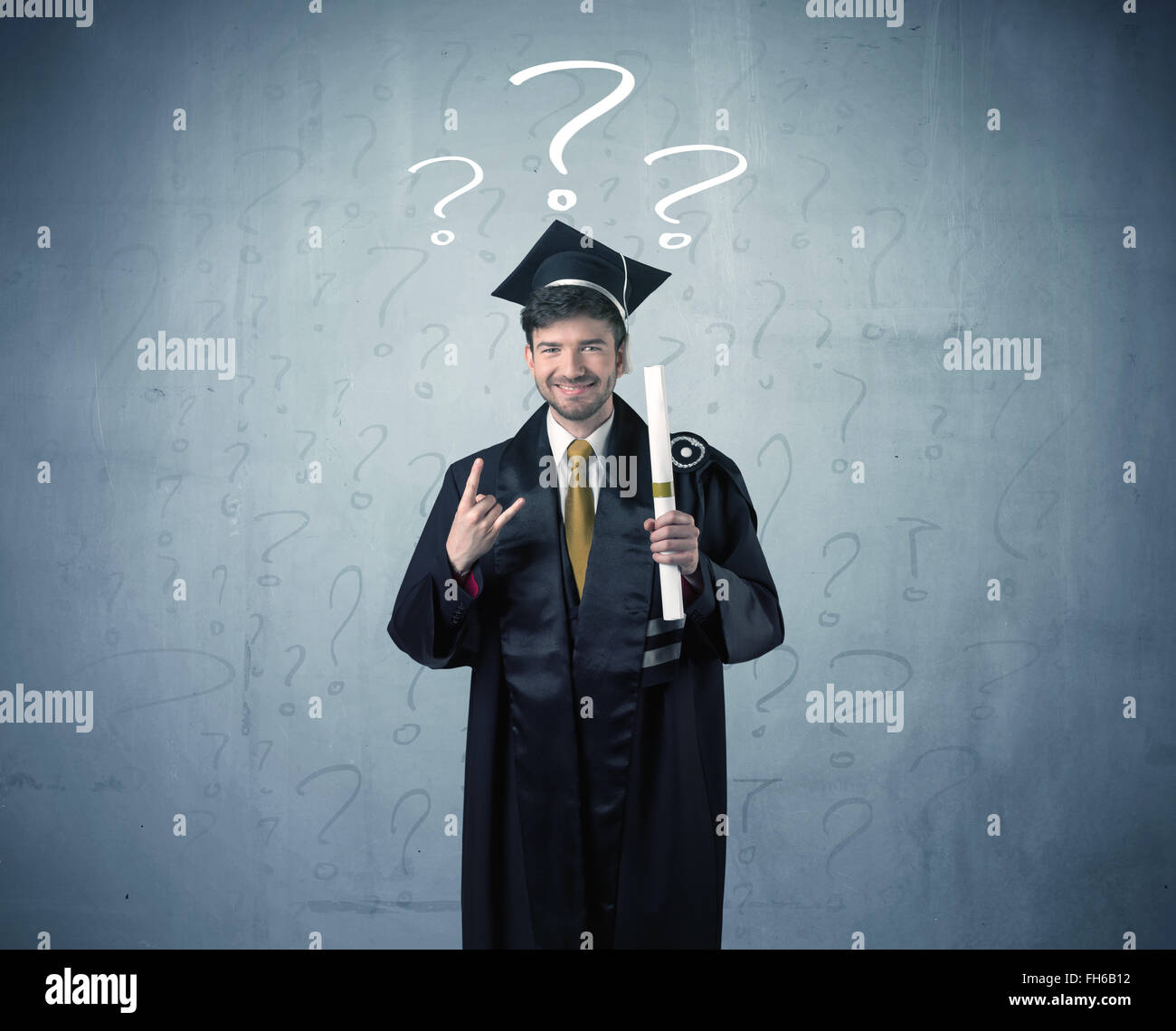Young graduate teenager with question marks drawn Stock Photo - Alamy