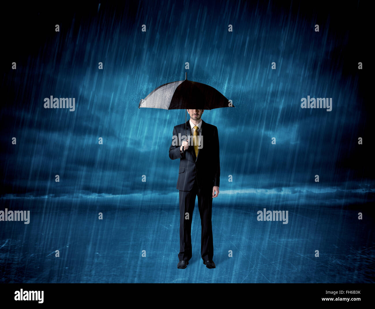 Man Standing In Rain