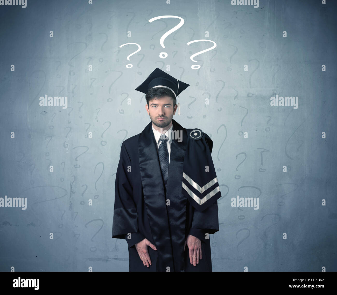 Young graduate teenager with question marks drawn Stock Photo - Alamy