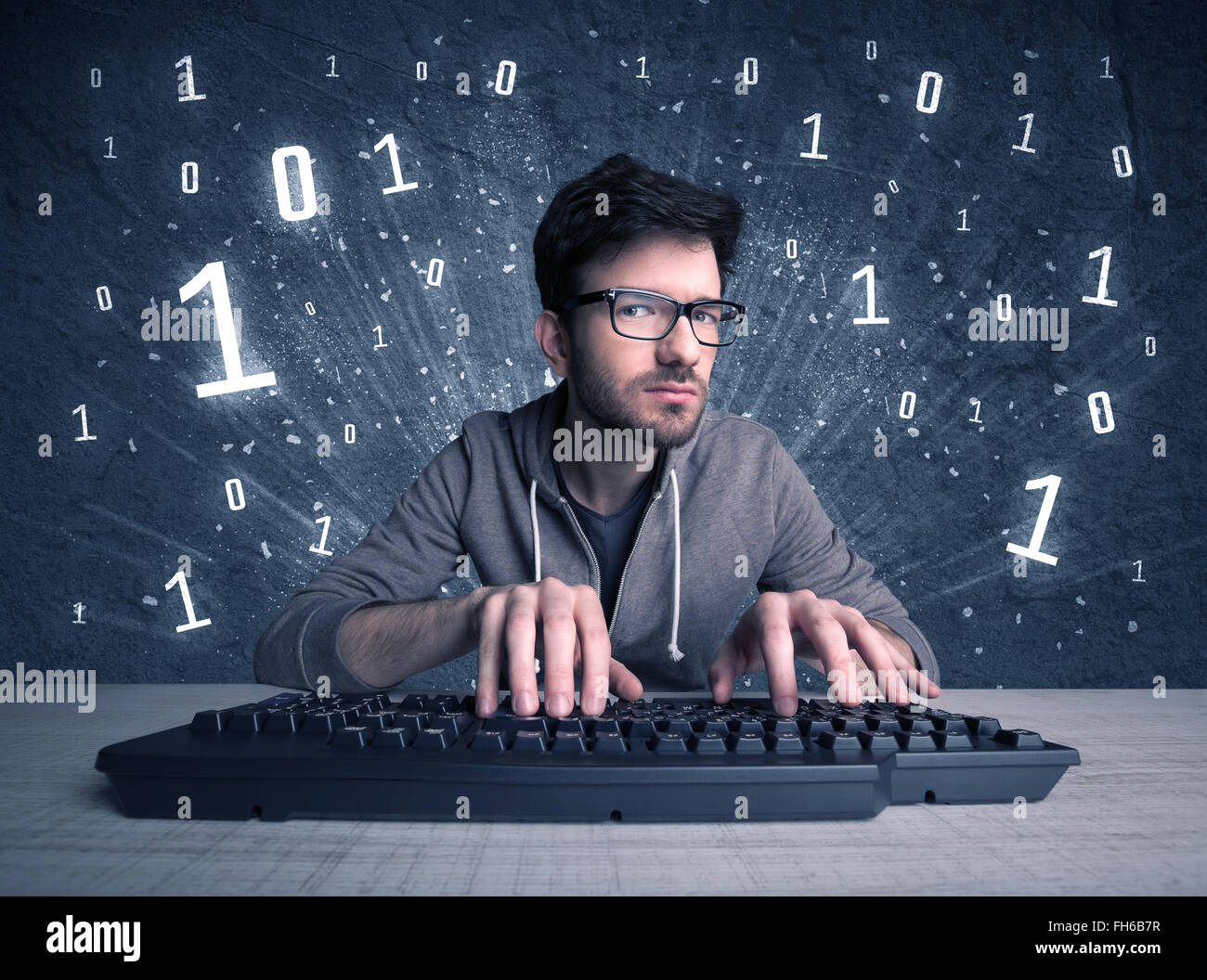 Online intruder geek guy hacking codes Stock Photo - Alamy