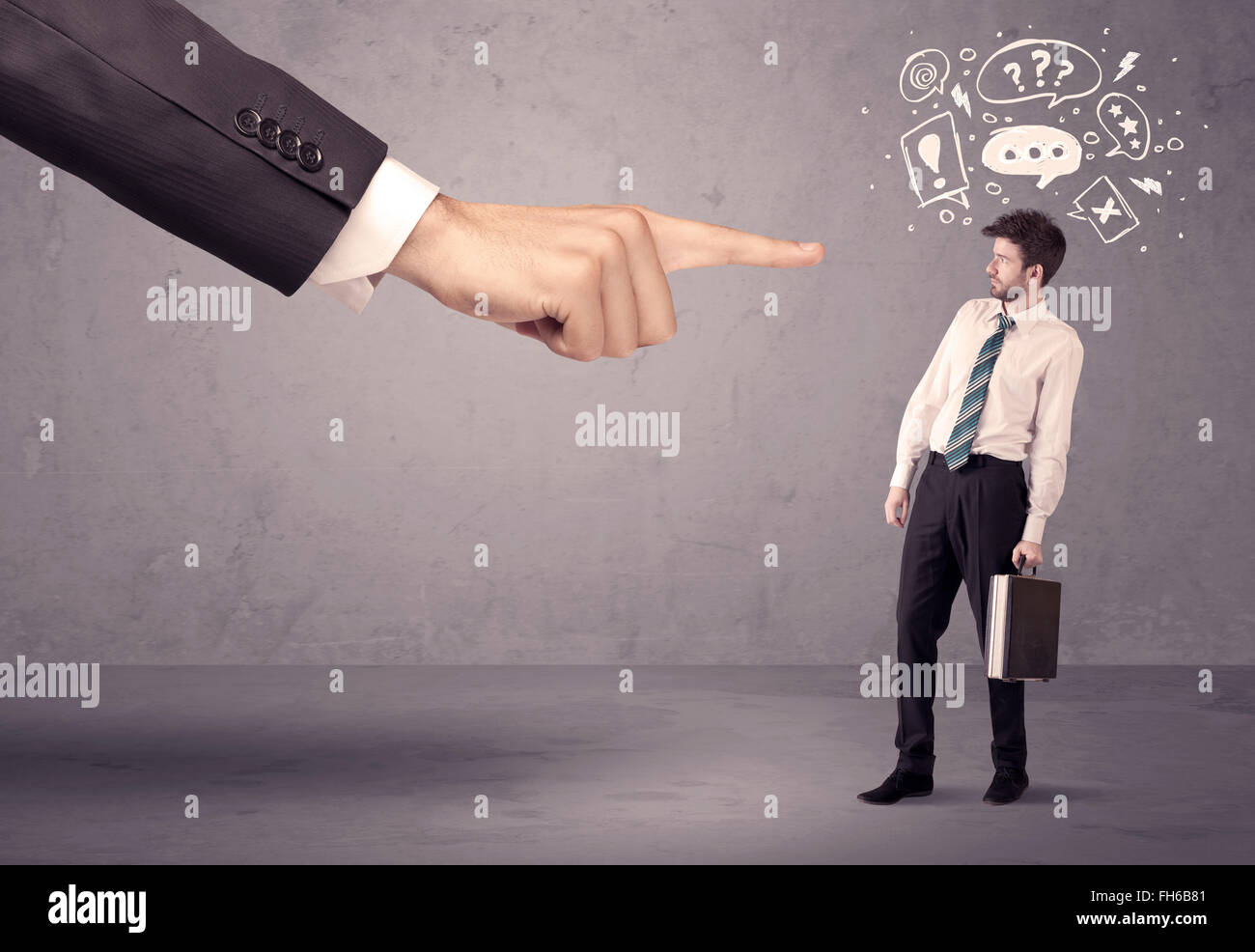 Boss hand pointing at confused employee Stock Photo - Alamy