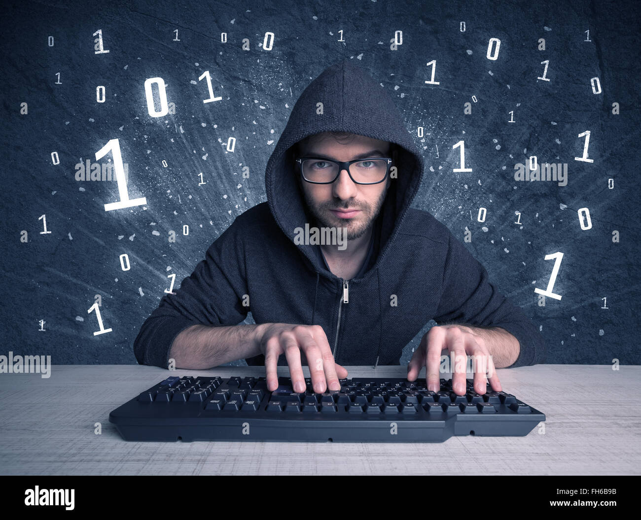 Online intruder geek guy hacking codes Stock Photo - Alamy