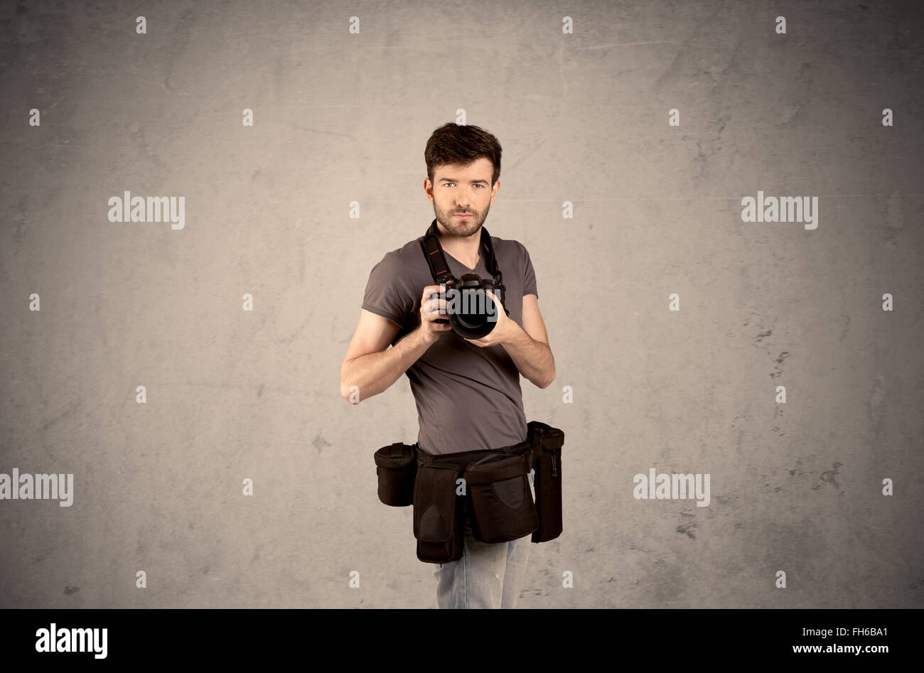 Hobby photographer holding camera Stock Photo - Alamy
