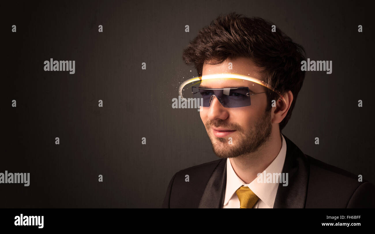 Handsome man looking with futuristic high tech glasses Stock Photo - Alamy