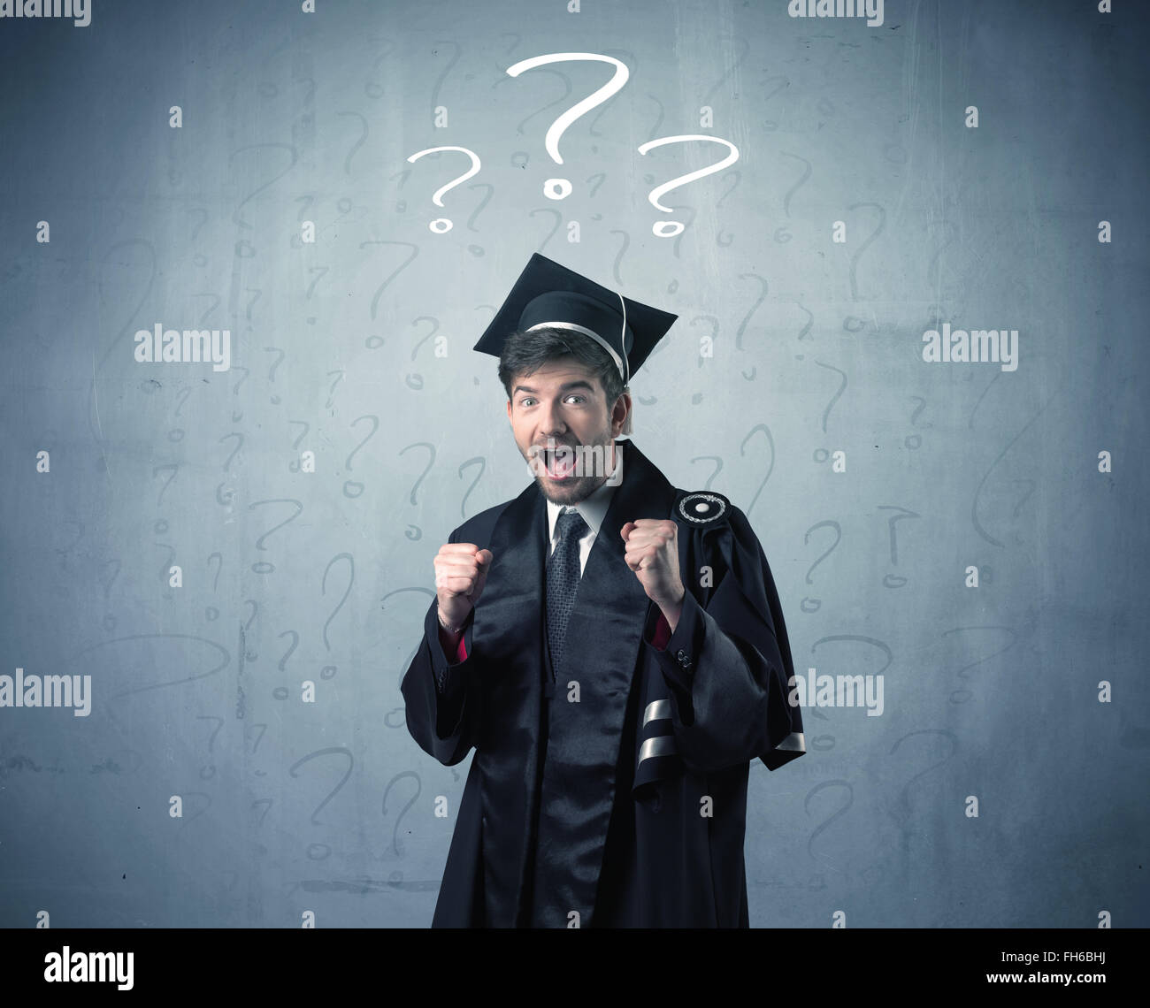 Young graduate teenager with question marks drawn Stock Photo - Alamy