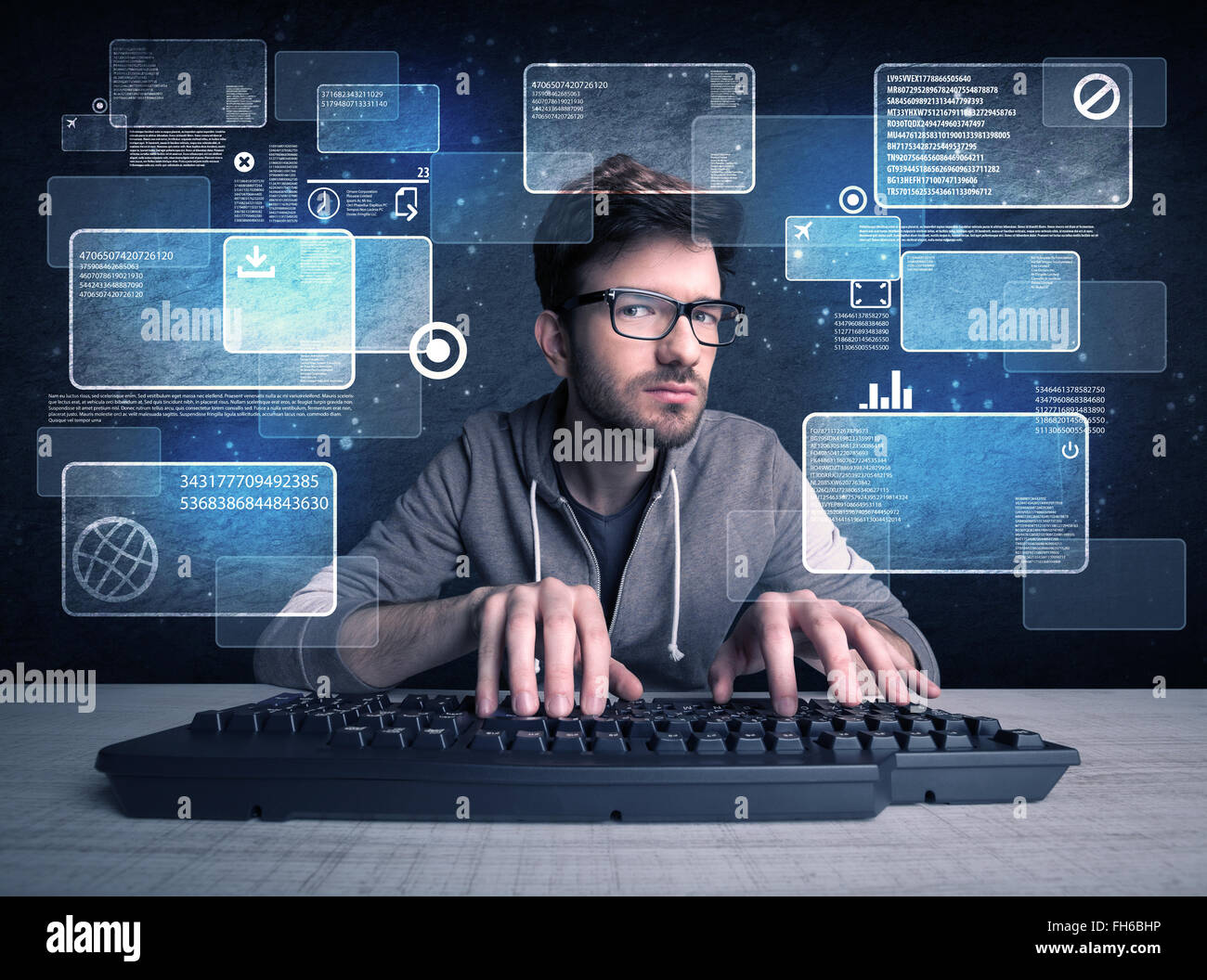 Nerd with glasses hacking websites Stock Photo - Alamy