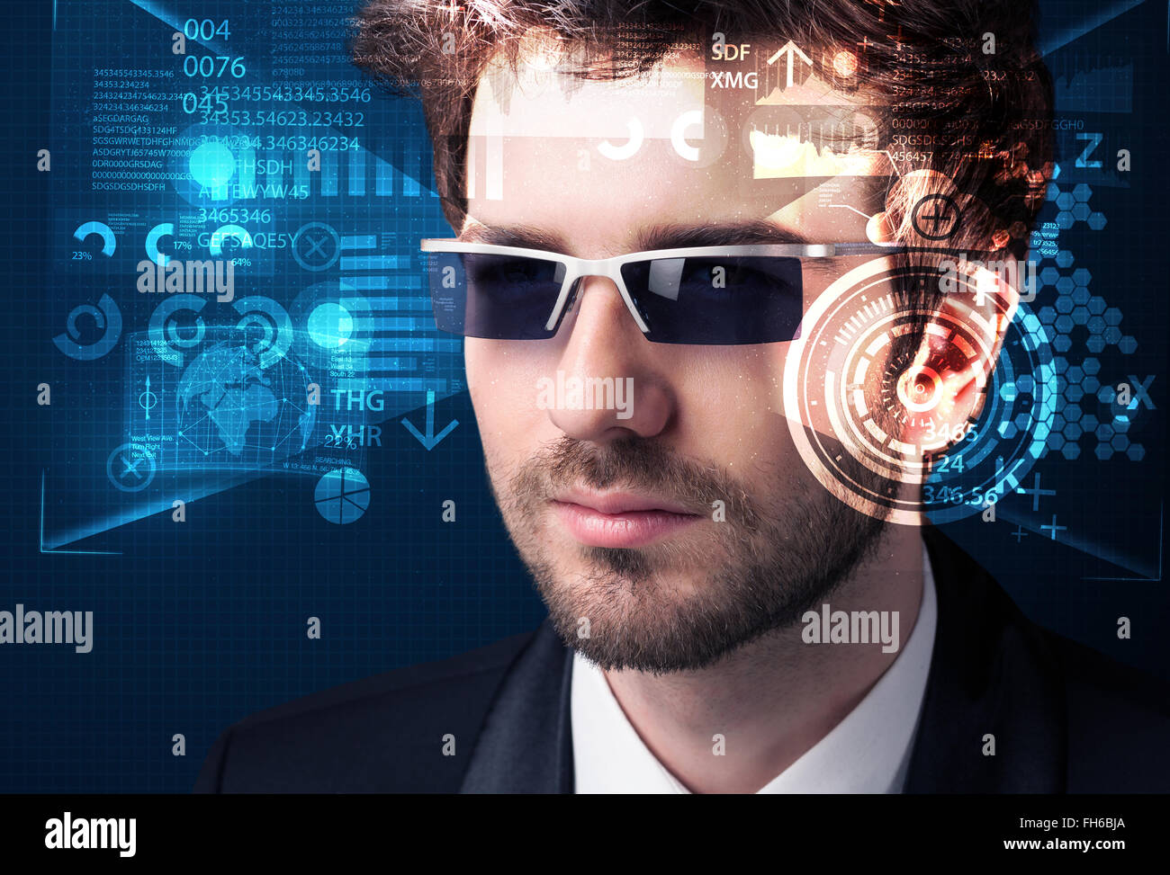 Young man looking with futuristic smart high tech glasses Stock Photo ...