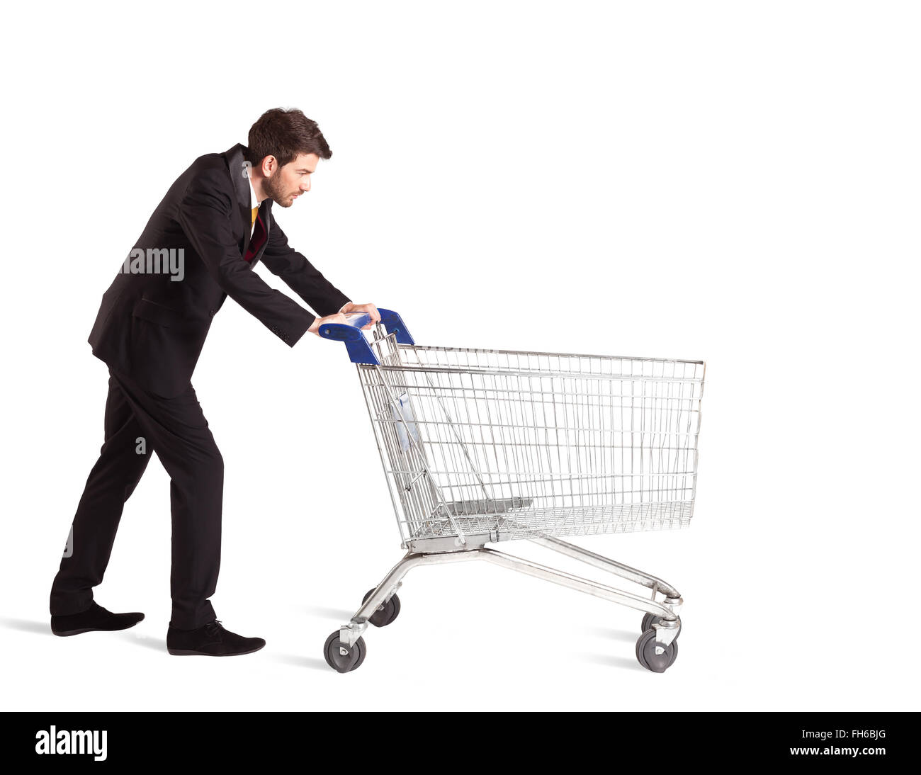 Businessman with shopping cart Stock Photo - Alamy