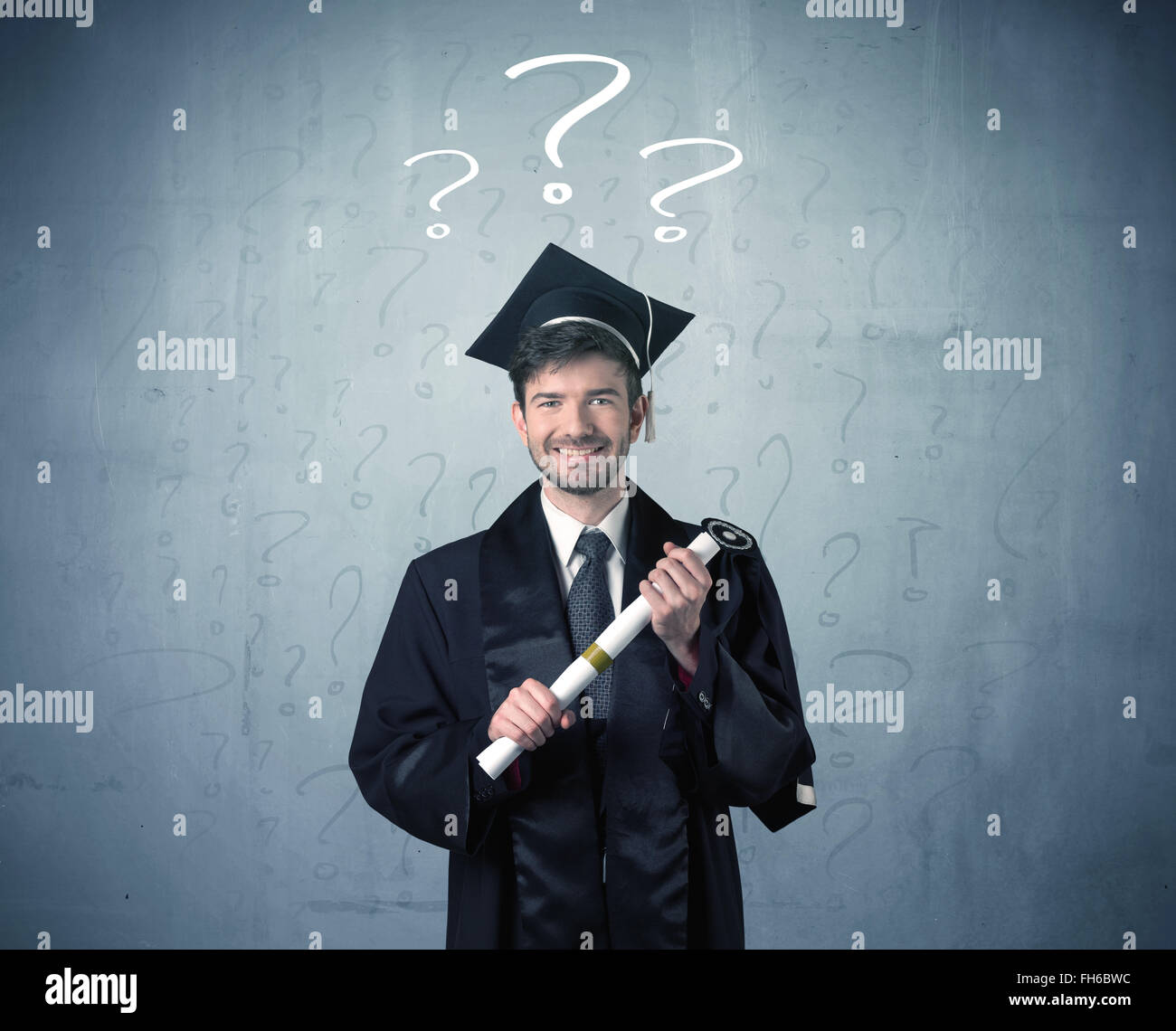 Young graduate teenager with question marks drawn Stock Photo - Alamy
