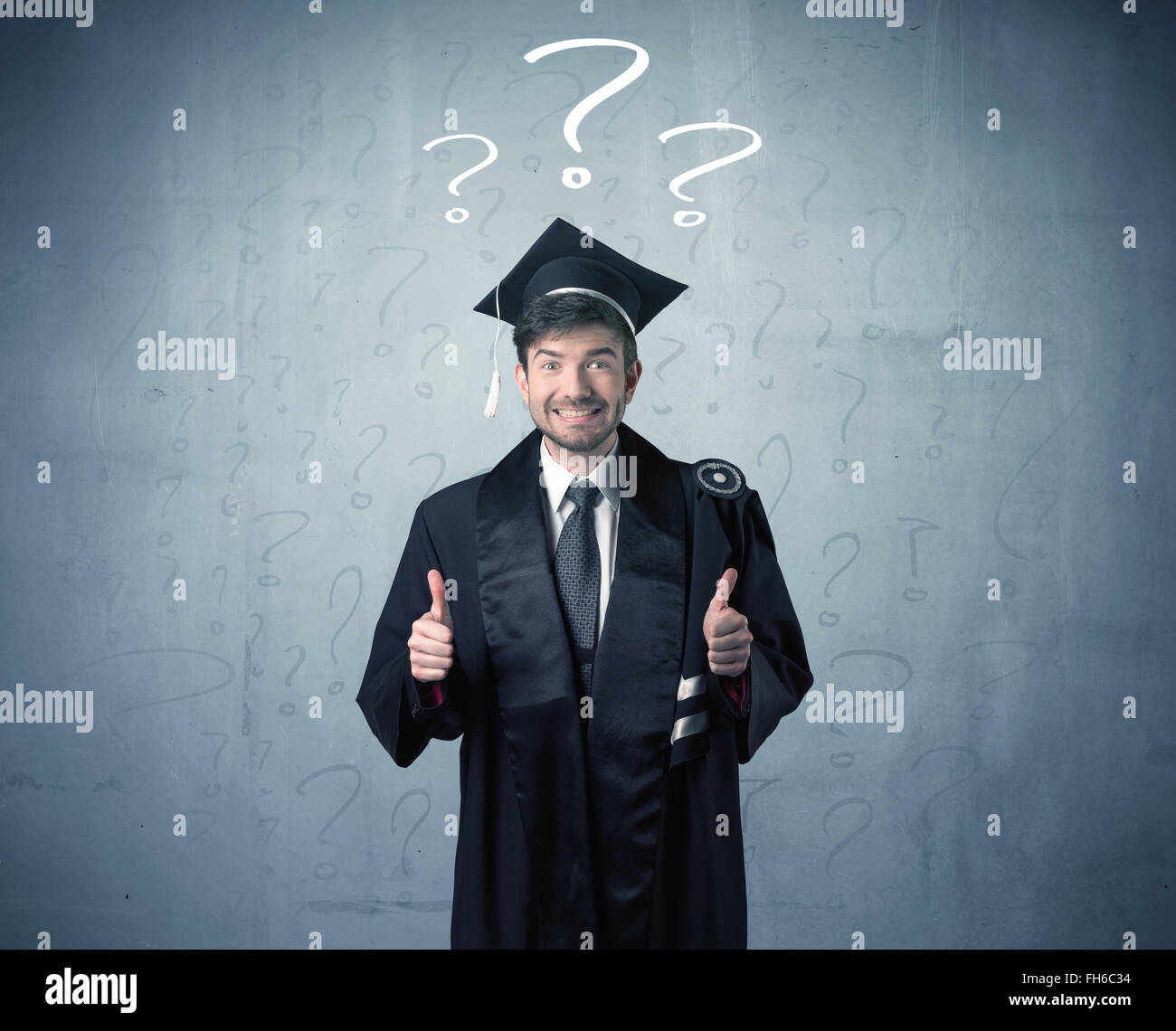 Young graduate teenager with question marks drawn Stock Photo - Alamy