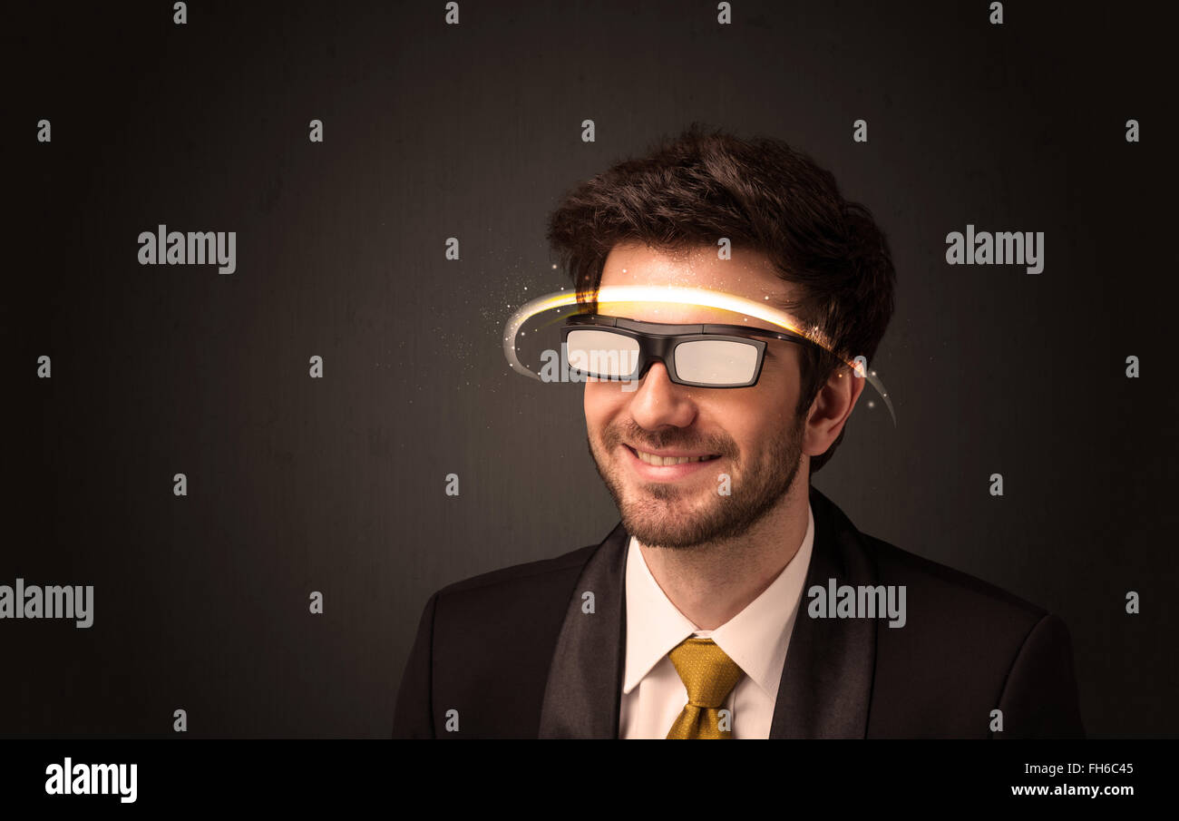 Handsome man looking with futuristic high tech glasses Stock Photo - Alamy