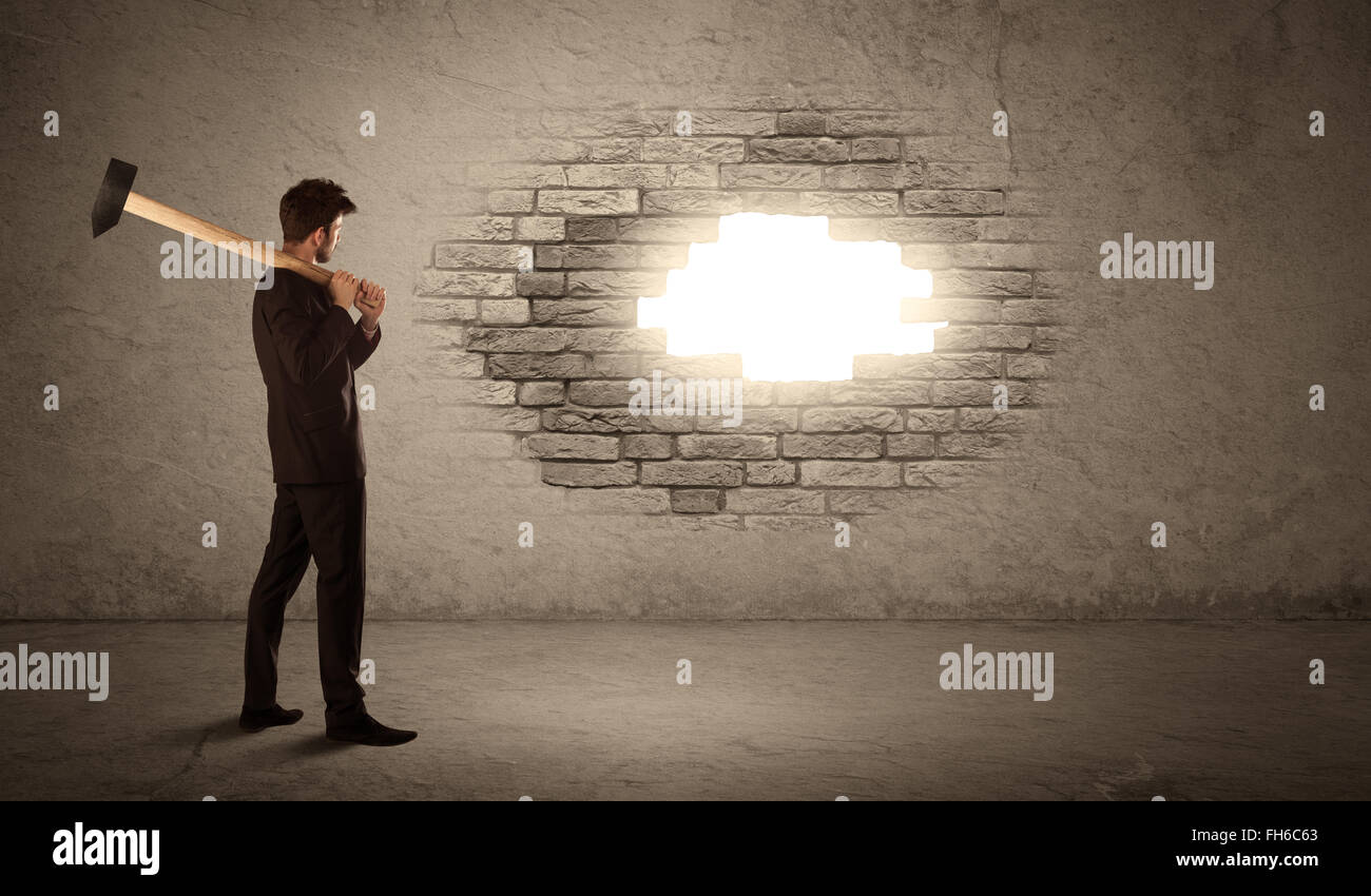 Business man hitting wall hammer hi-res stock photography and images ...