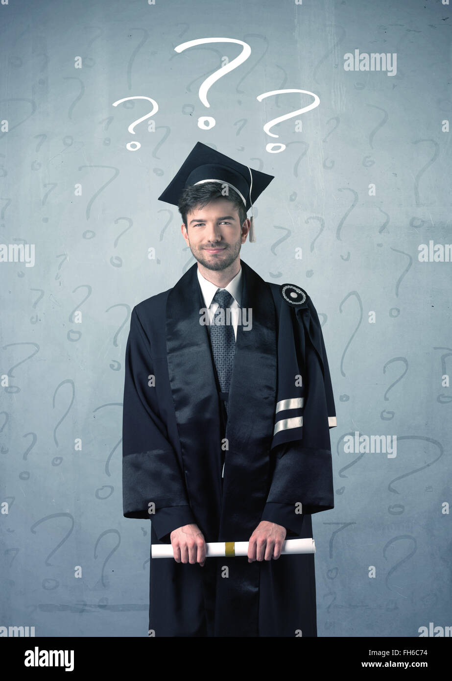 Young graduate teenager with question marks drawn Stock Photo - Alamy
