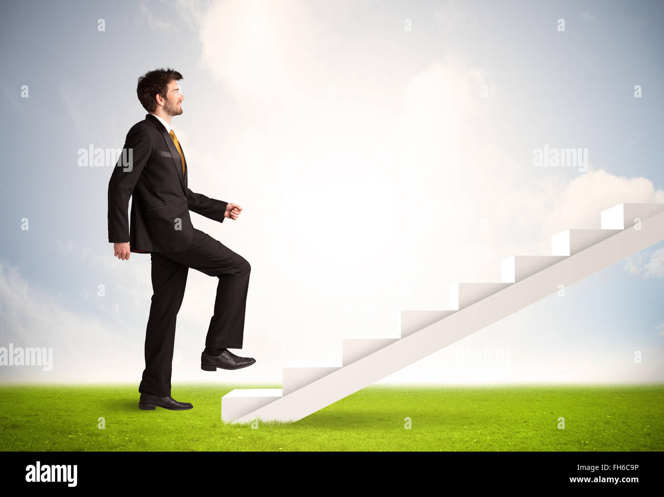 Business person climbing up on white staircase in nature Stock Photo ...
