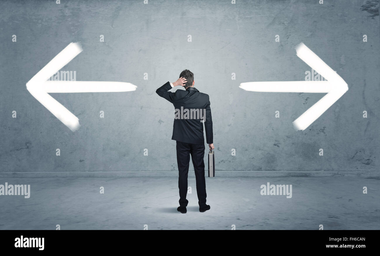 Confused business person choosing the way Stock Photo - Alamy
