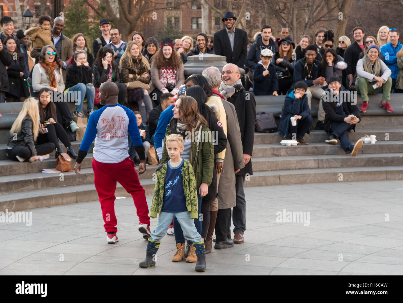 Crowd of people being entertained by street performers in Washington ...