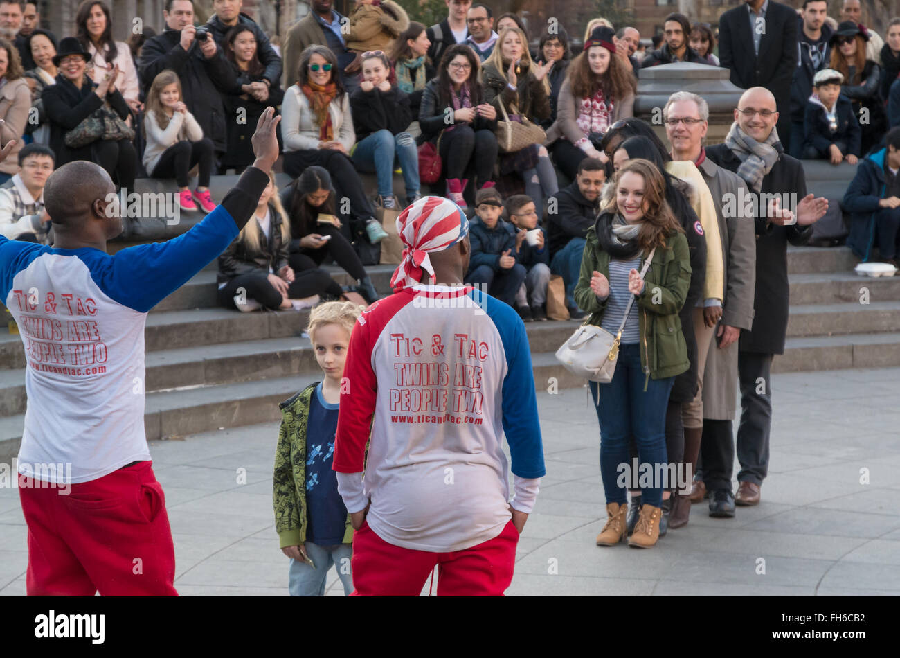 Crowd of people being entertained by street performers in Washington ...