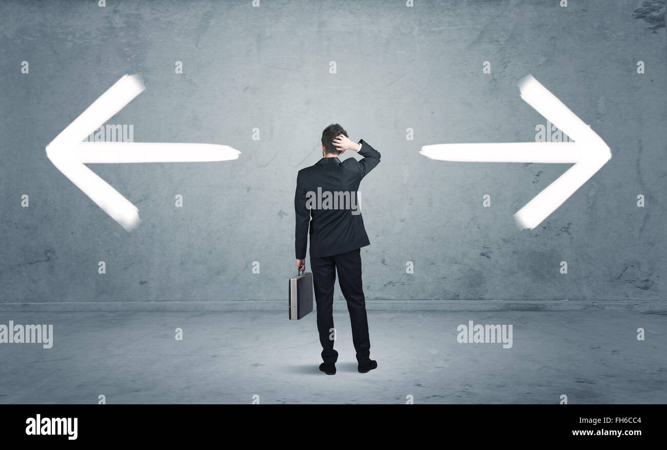 Confused business person choosing the way Stock Photo - Alamy