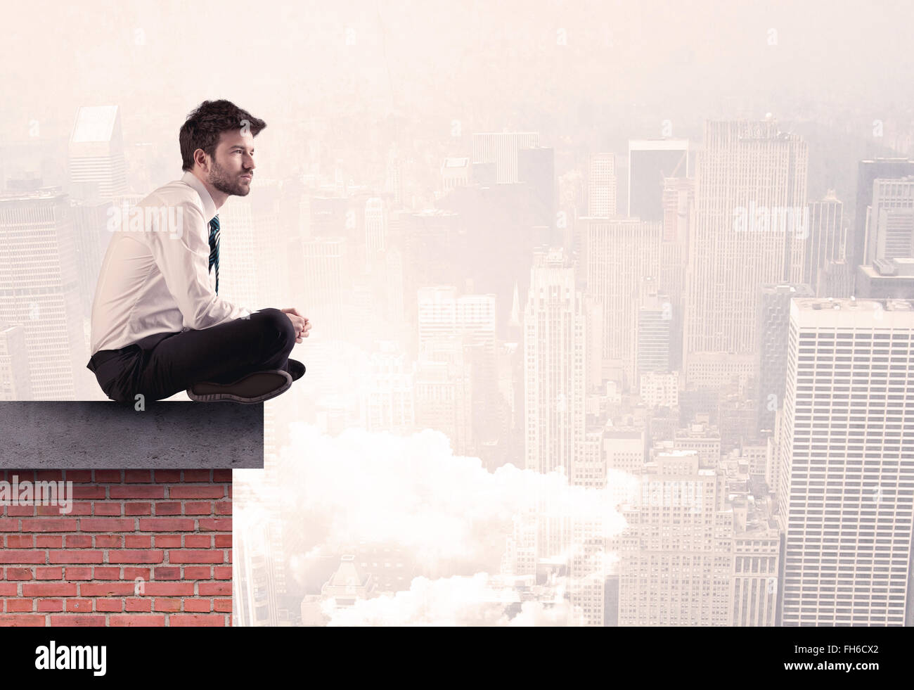 Office worker sitting on rooftop in city Stock Photo - Alamy