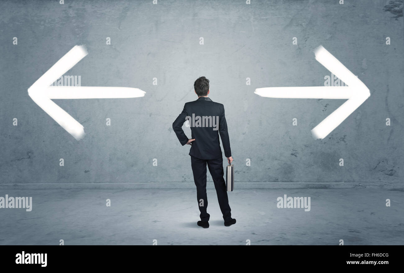 Confused business person choosing the way Stock Photo - Alamy