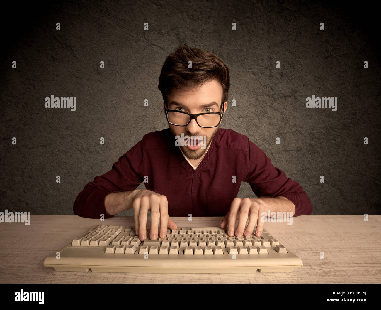 Computer geek typing on keyboard Stock Photo - Alamy