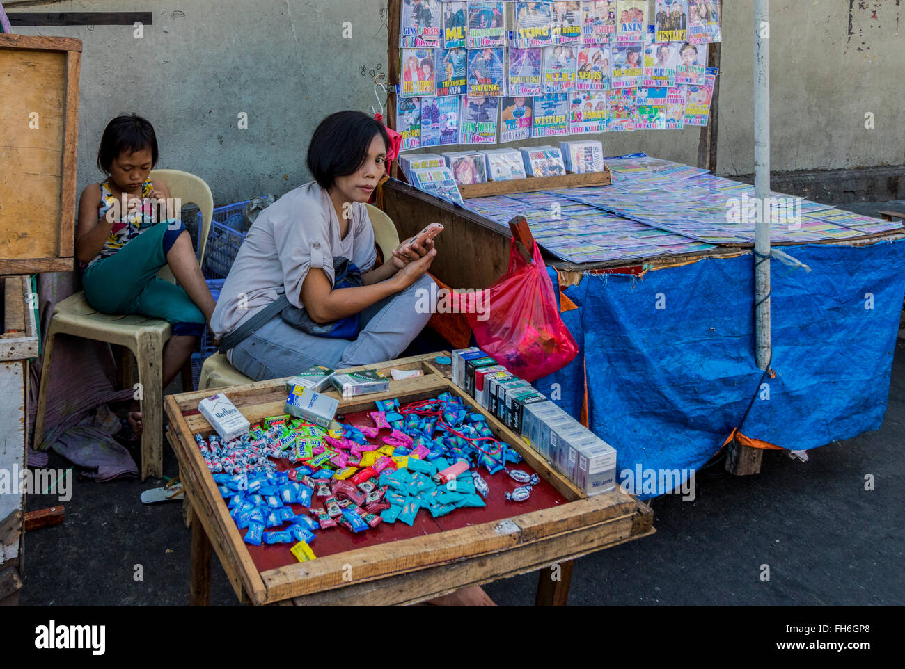 Lady trader working from stall in Luzon Manila Philippines Stock Photo ...