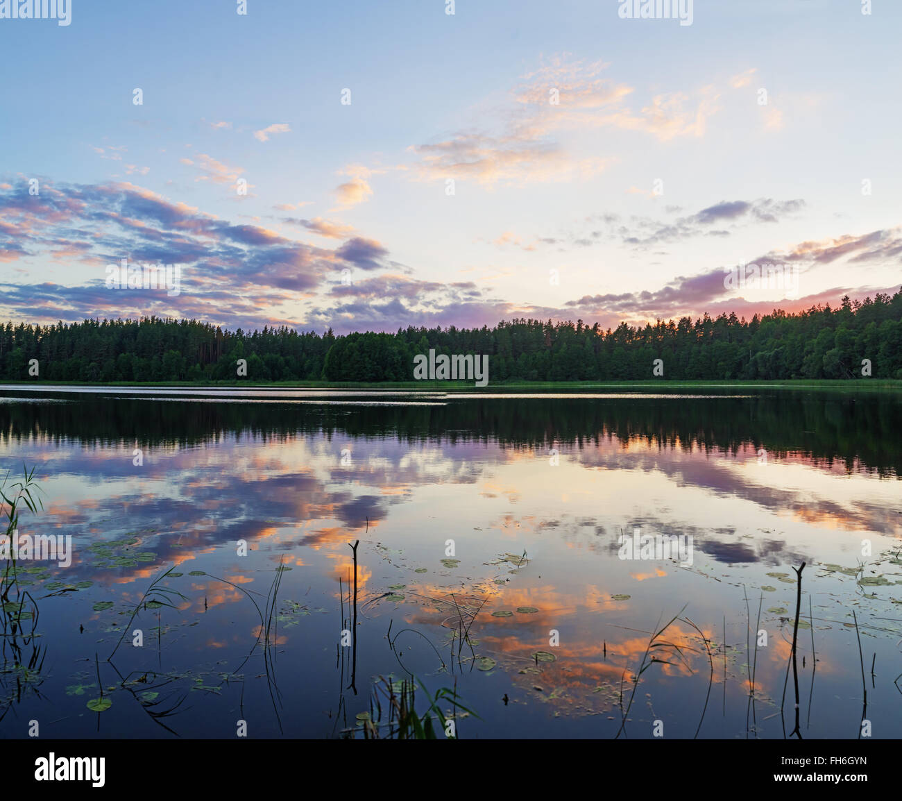 Pink sunset over lake Stock Photo - Alamy