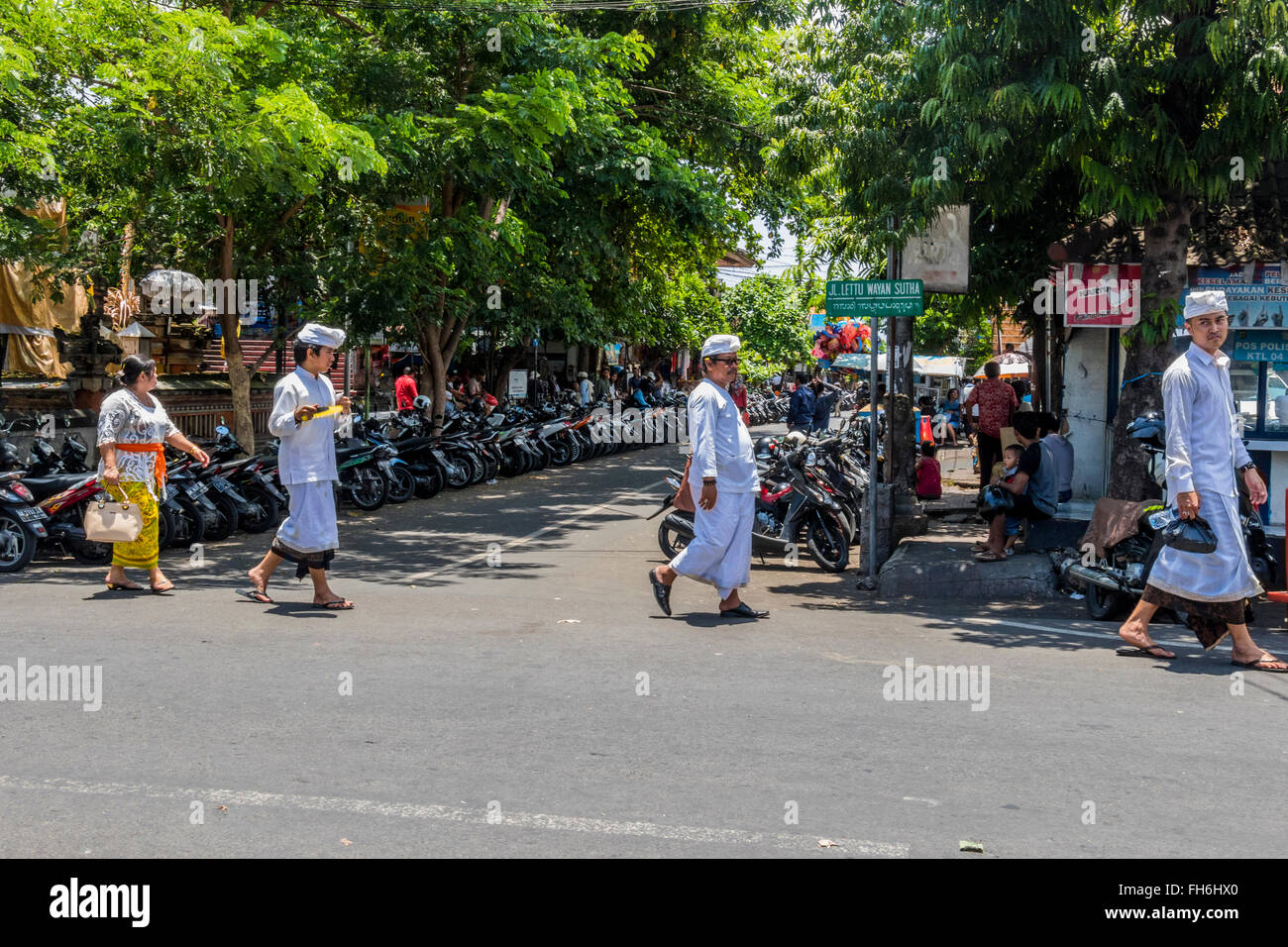 local people in people in traditional clothes crossing the road in ...