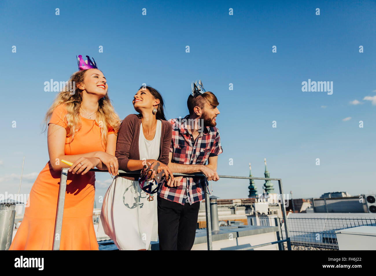 Austria, Vienna, Young people having a party on rooftop terrace Stock ...