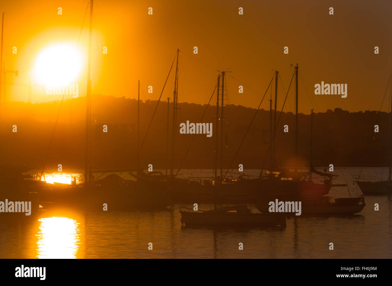Magnificent sunset color in marina harbor. End of a warm sunny day in ...