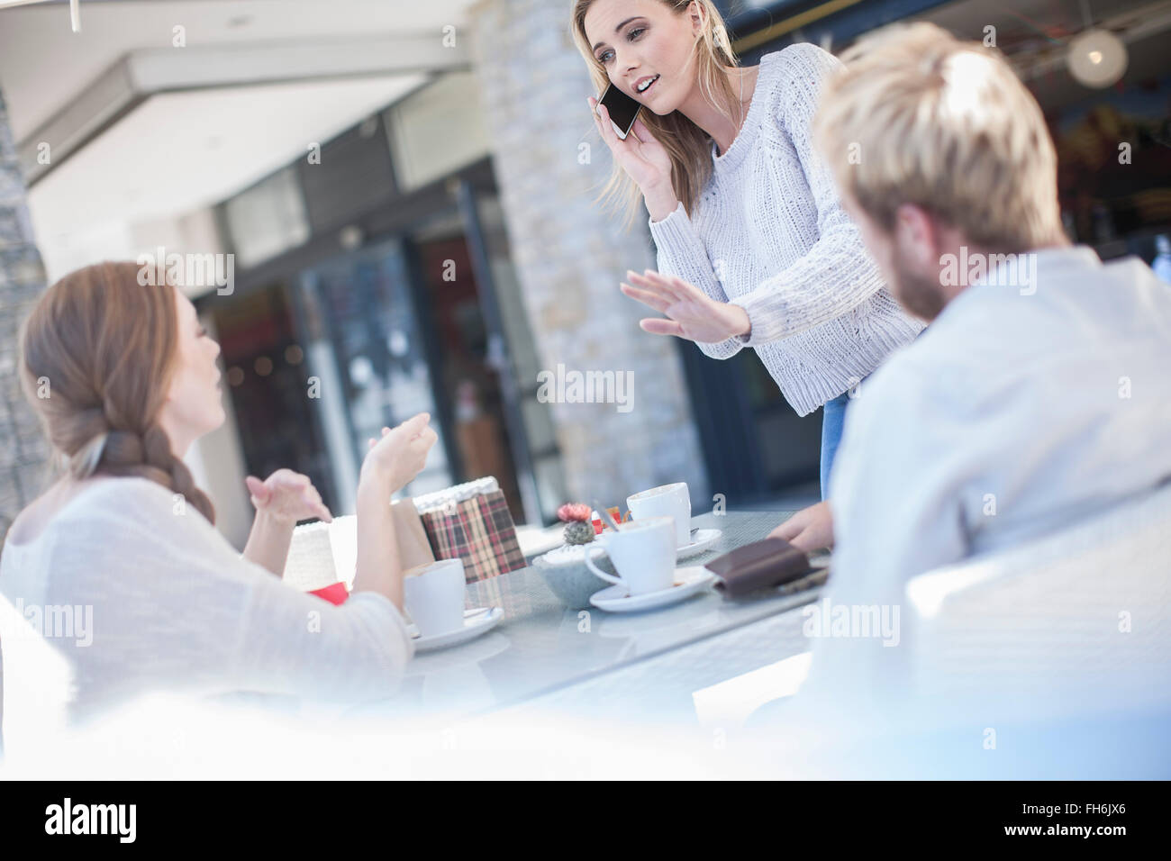 Friends meeting in outdoor cafe Stock Photo - Alamy