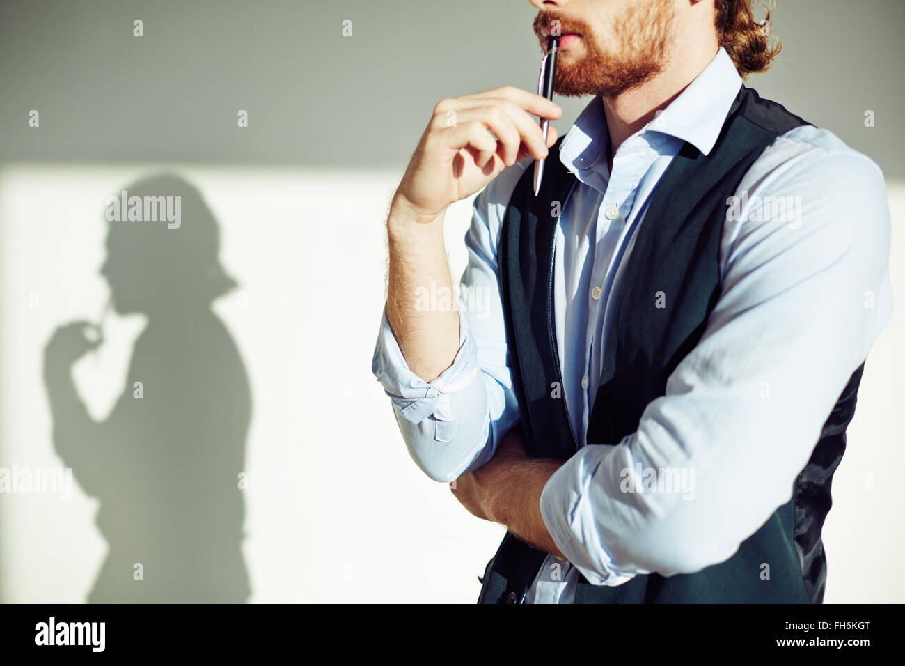 Pensive pen mouth hi-res stock photography and images - Alamy