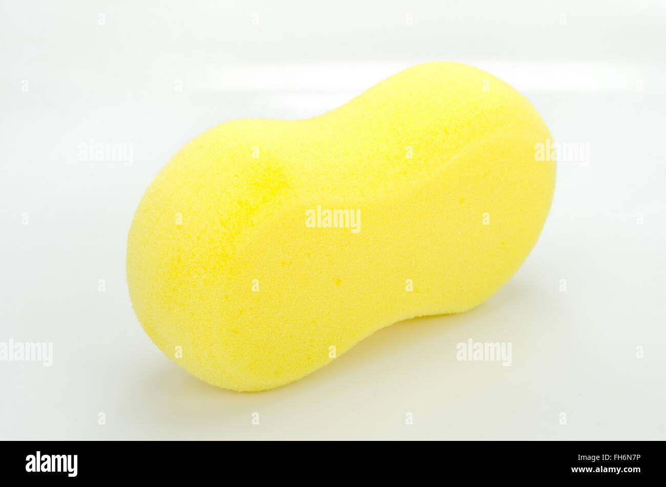 Yellow sponge for car washing on white background Stock Photo - Alamy