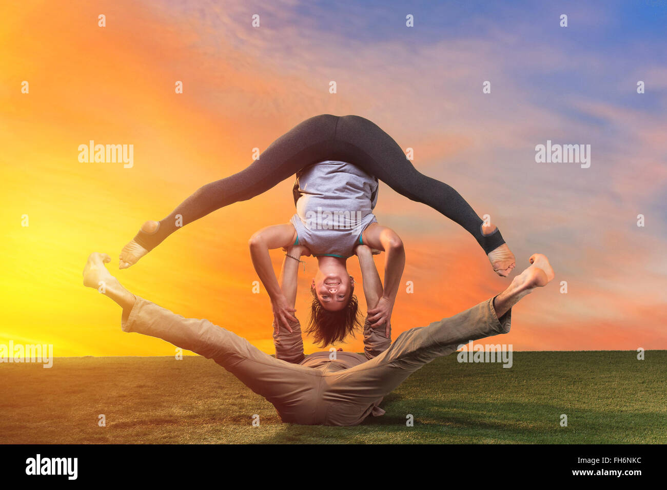 The two people doing yoga exercises Stock Photo - Alamy
