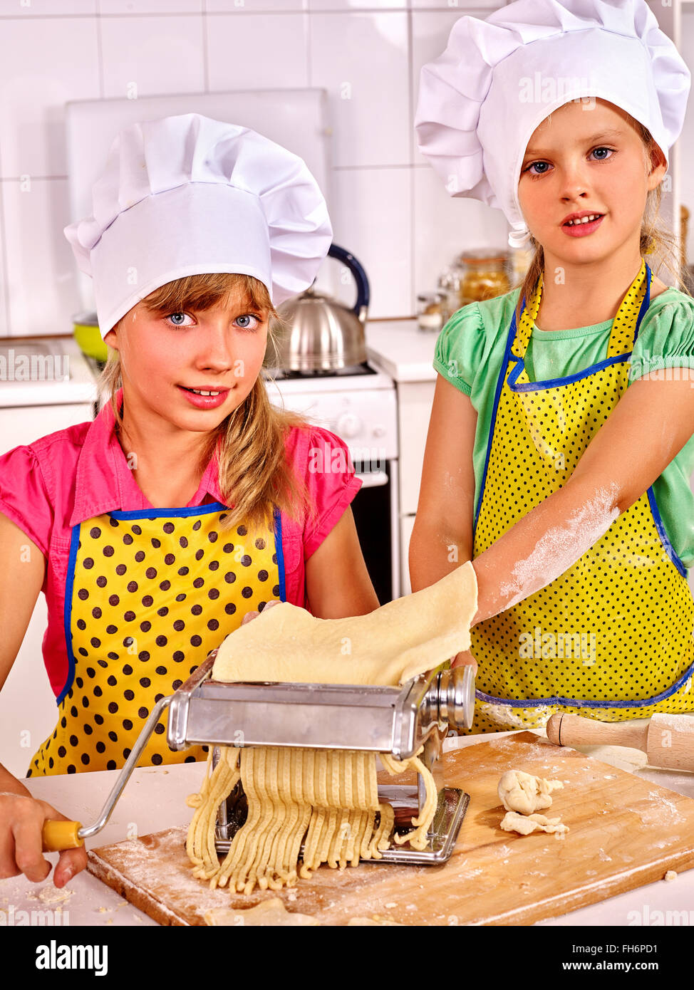 Kids in hat making homemade pasta at kitchen Stock Photo - Alamy