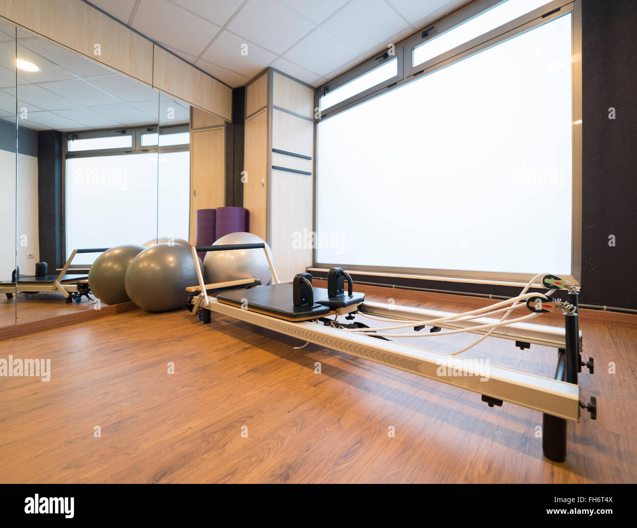 Training room in a pilates gym Stock Photo - Alamy