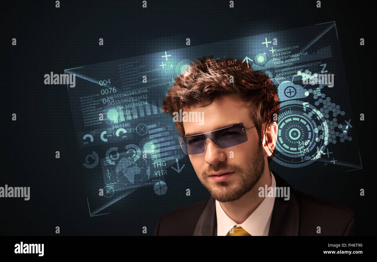 Young man looking with futuristic smart high tech glasses Stock Photo ...