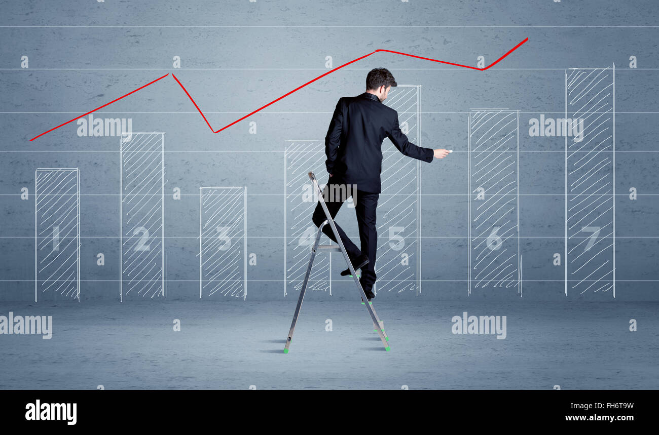Man drawing chart from ladder Stock Photo - Alamy