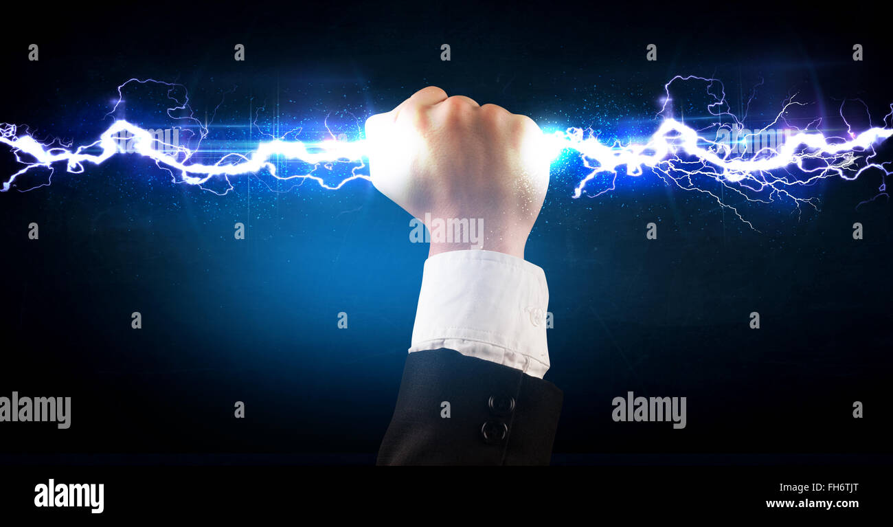 Business man holding electricity light bolt in his hands Stock Photo ...