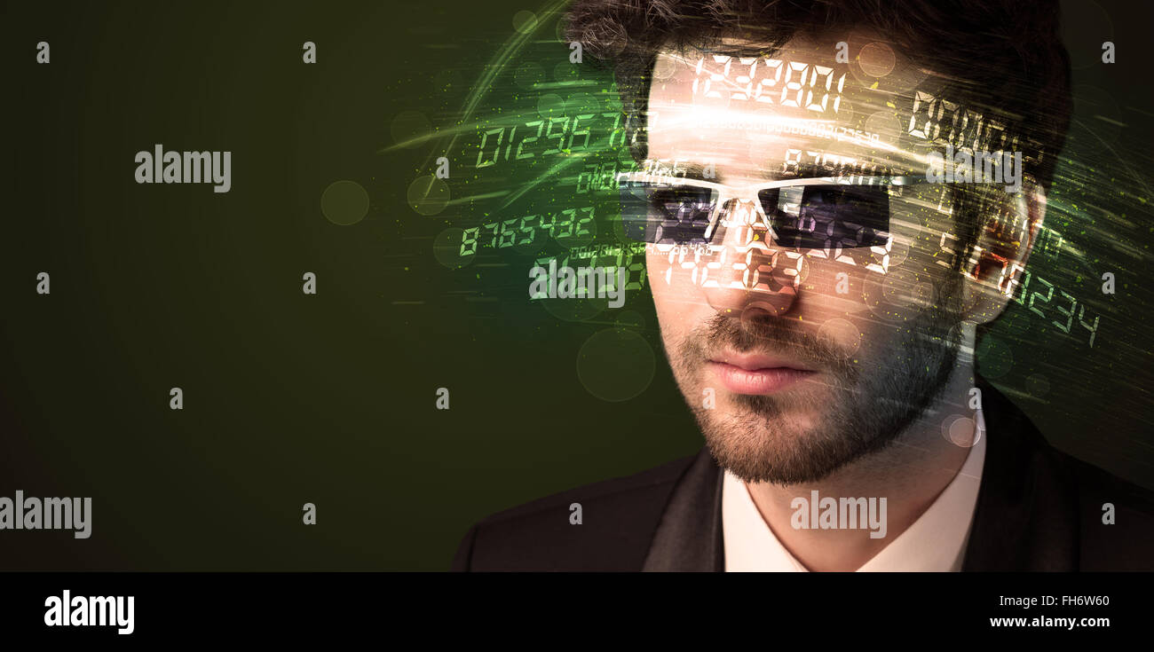 Business man looking at high tech number calculations Stock Photo - Alamy