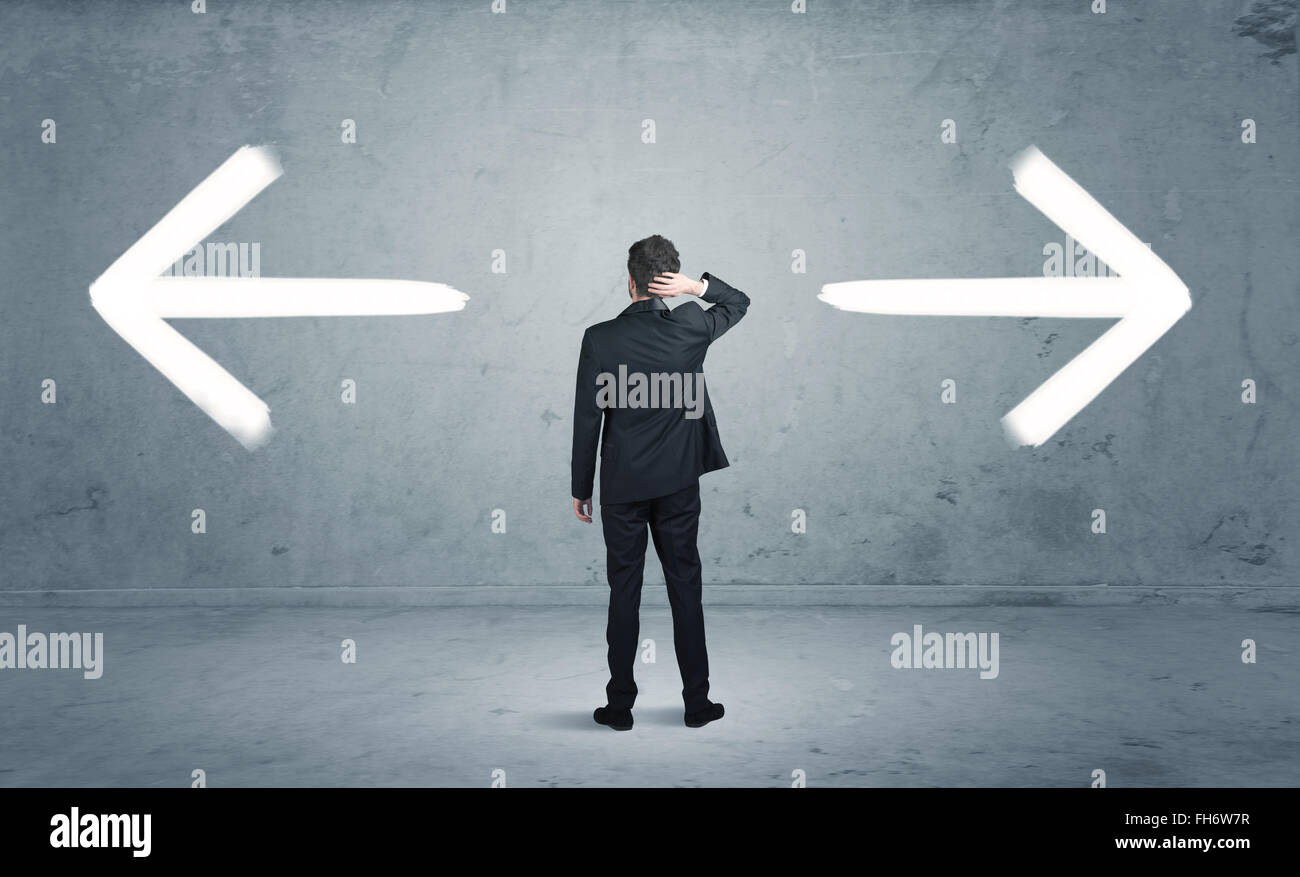 Confused business person choosing the way Stock Photo - Alamy