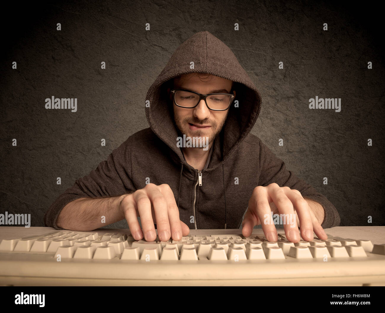 Computer geek typing on keyboard Stock Photo - Alamy