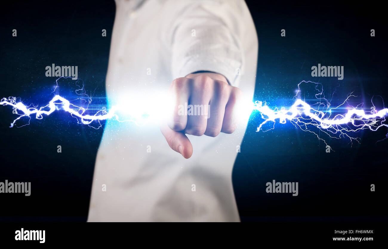Business man holding electricity light bolt in his hands Stock Photo ...