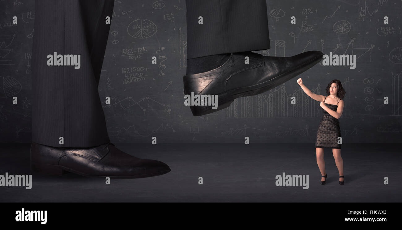 Huge leg stepping on a tiny businnesswoman concept Stock Photo - Alamy