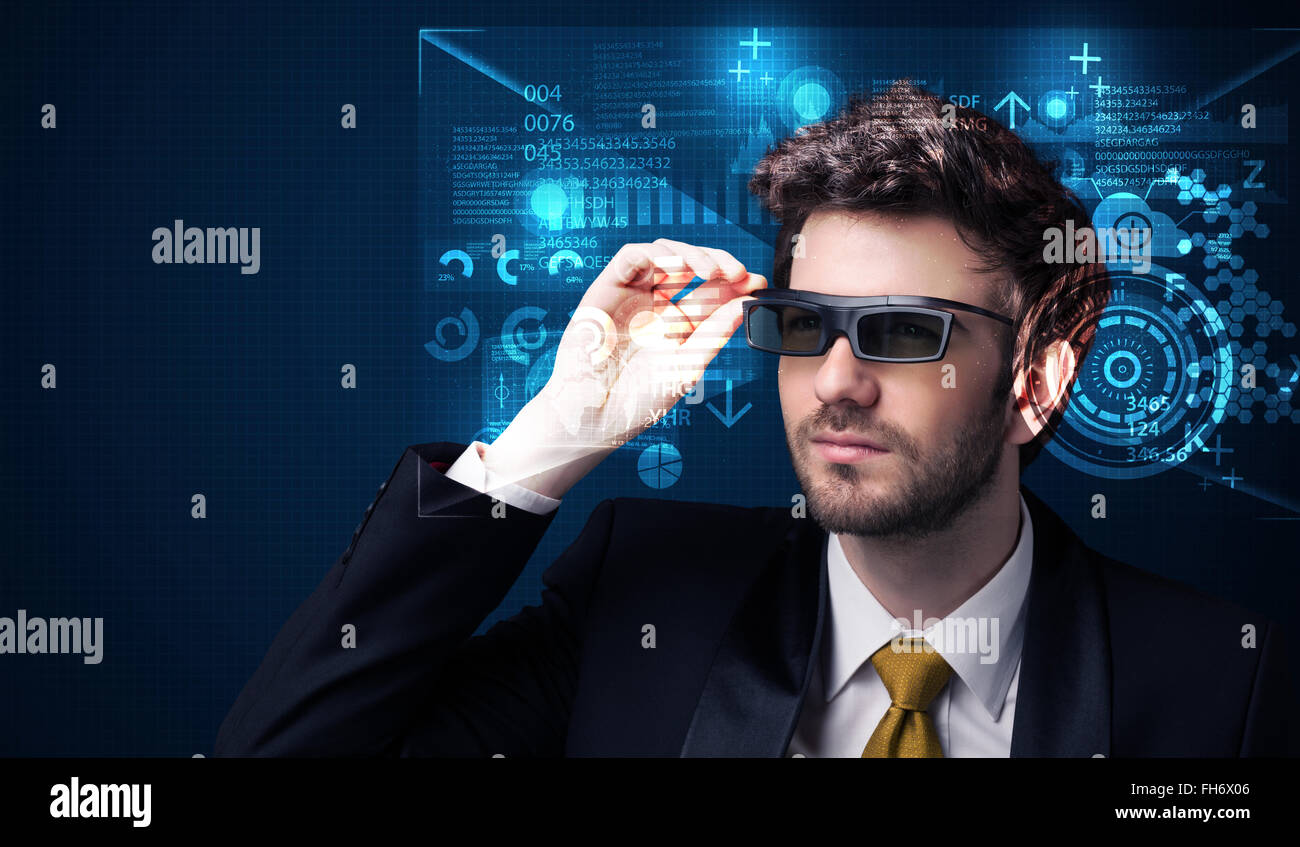 Young man looking with futuristic smart high tech glasses Stock Photo ...
