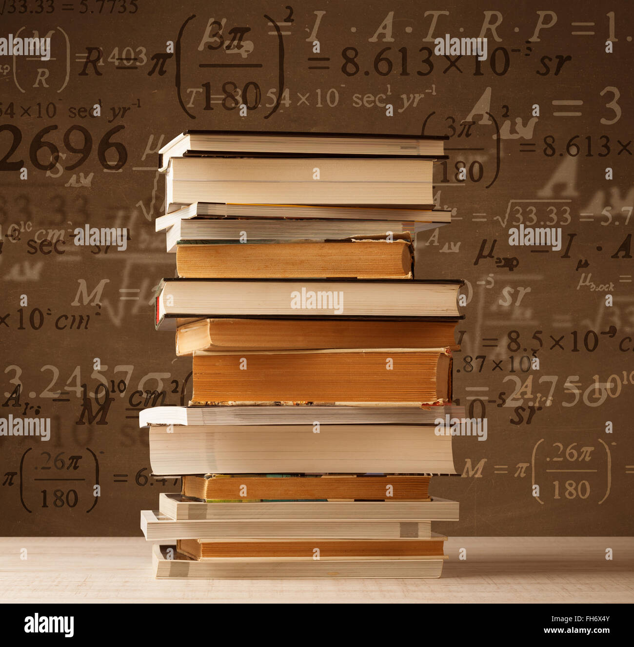 Books on vintage background with math formulas Stock Photo - Alamy